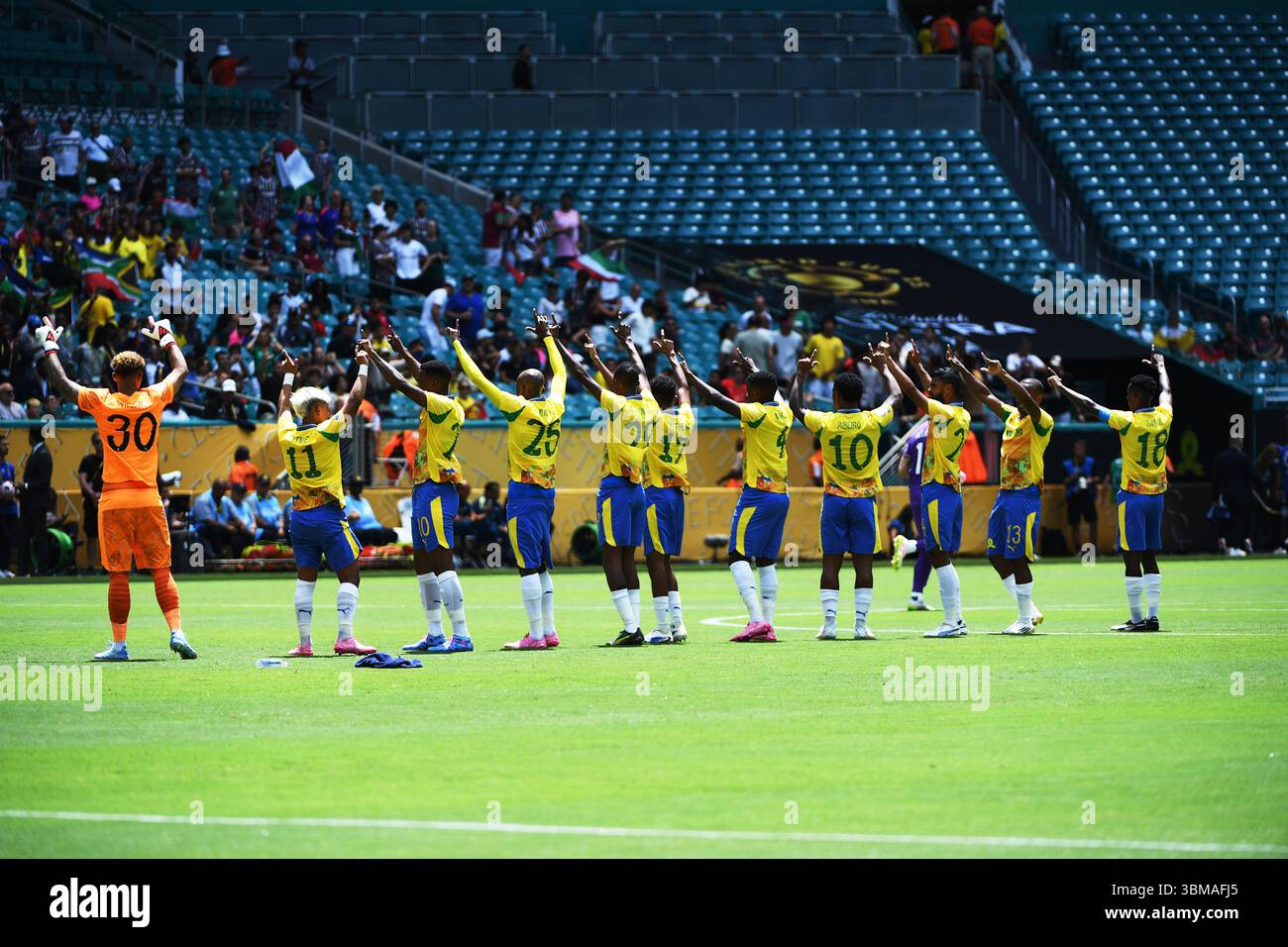 Miami, USA. 25th June, 2025. Players from Mamelodi Sundowns raise their ...