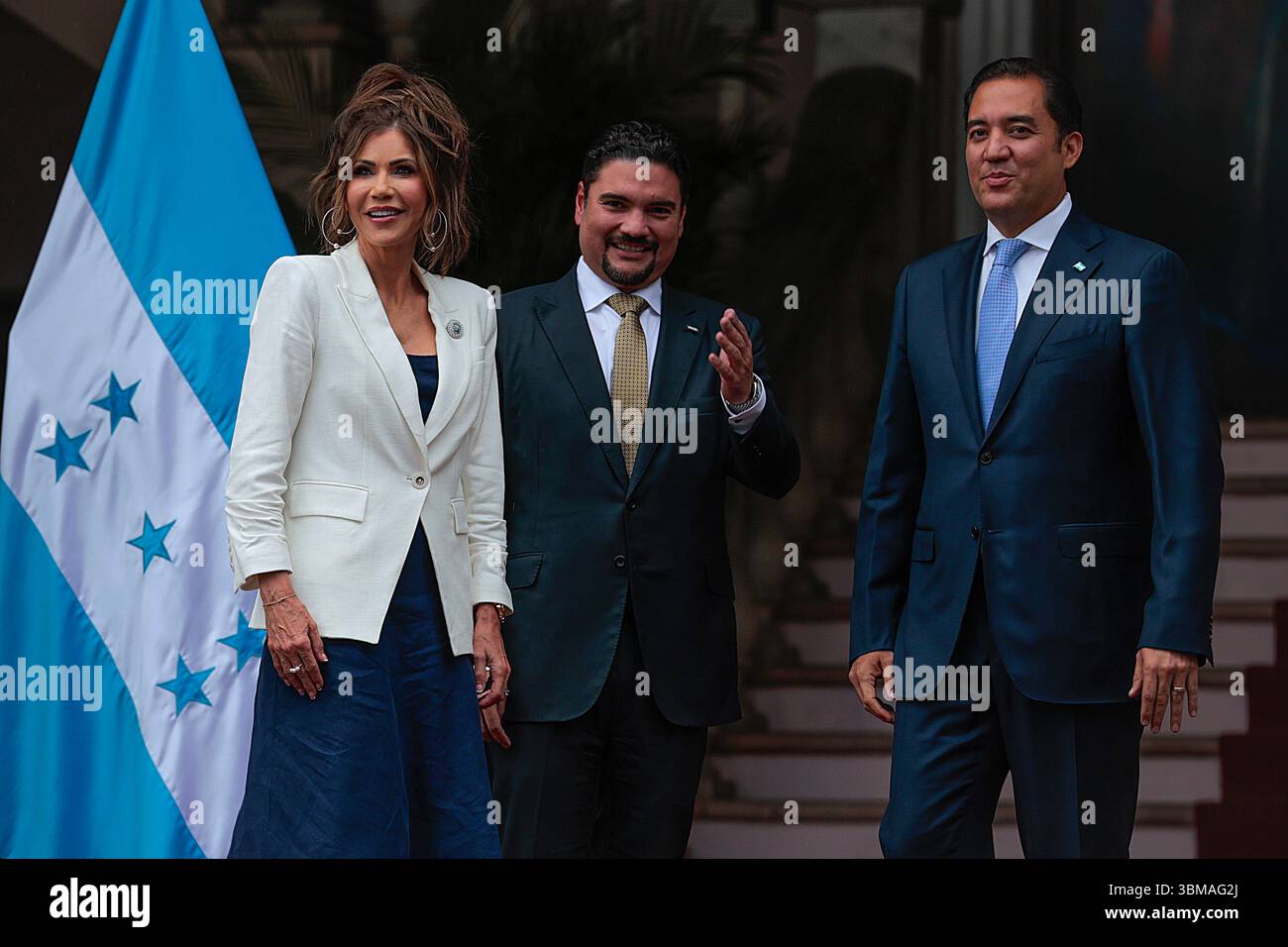 U.S. Homeland Security Secretary Kristi Noem, left, looks out alongside ...