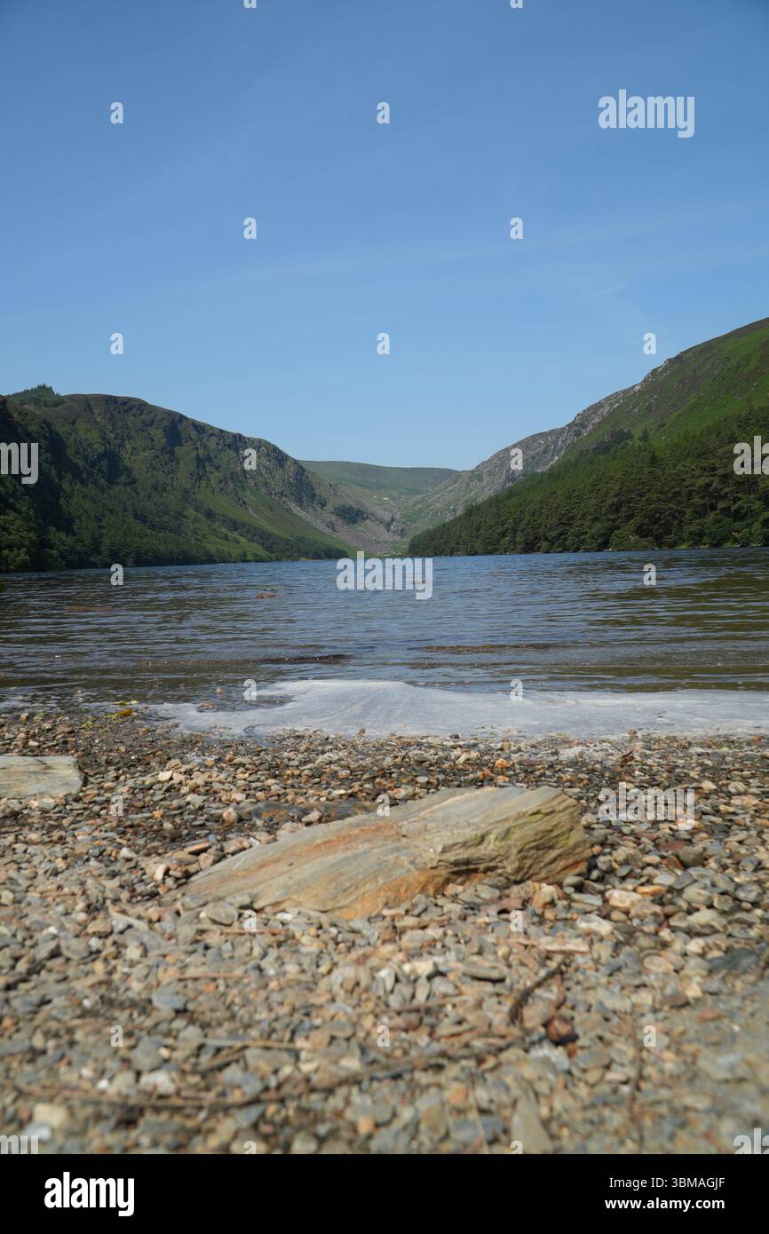 Glendalough upper lake. Scenic view of the lake nestled in a valley ...