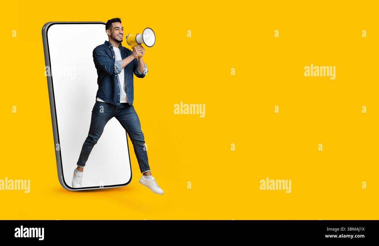 Man jumping out of smartphone with empty screen, making announcement ...