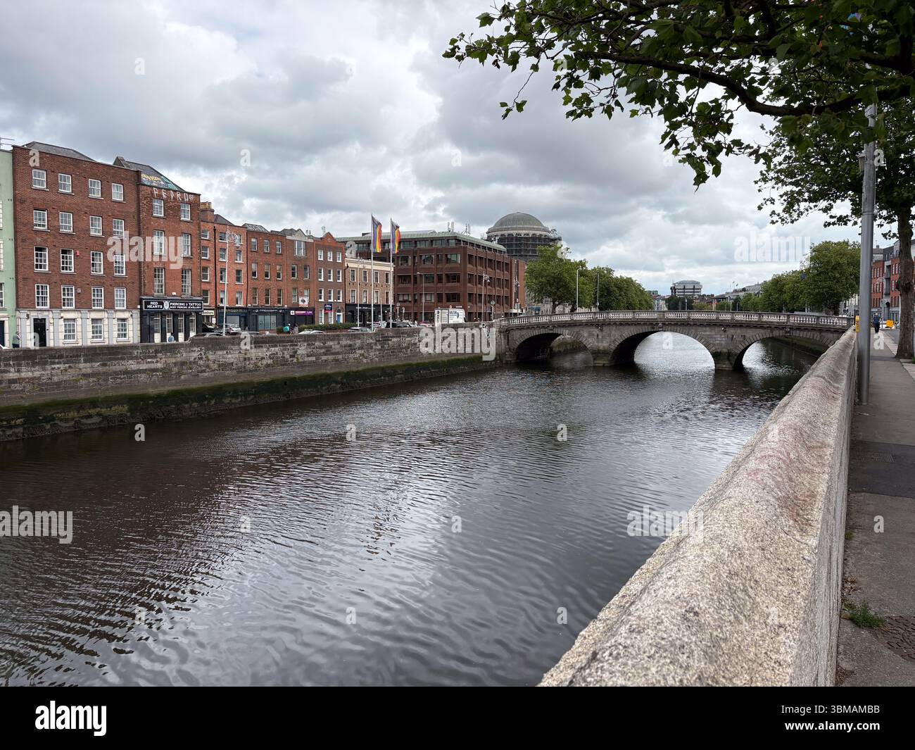 View of the River Liffey and a bridge with traditional and modern ...