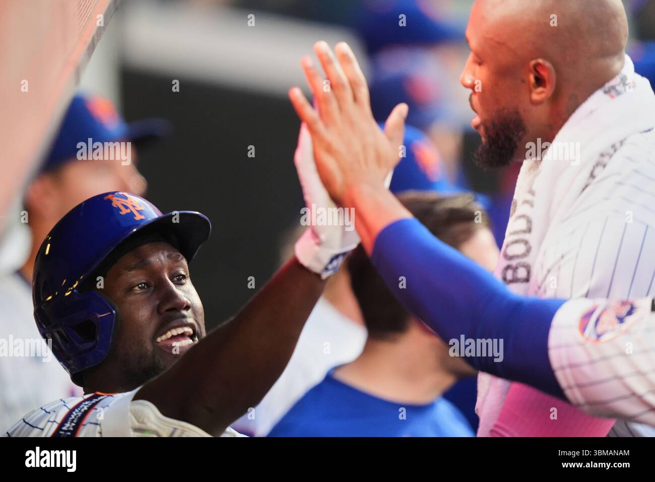 New York Mets' Ronny Mauricio celebrates with teammates after hitting a ...