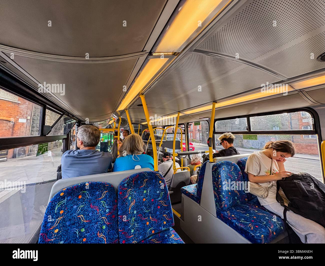 Inside a bus in Dublin, Ireland, showing passengers seated during a ...