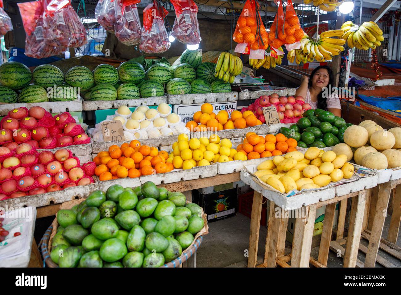 May 13, 2025: Calapan City, Philippines, woman vendor at fruit stall ...