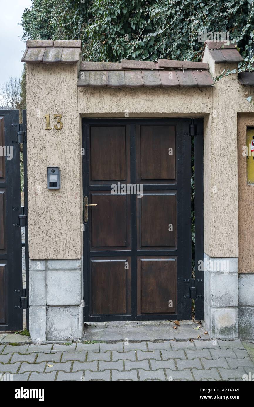 Gate No. 13 made of dark wood or metal, with rectangular panels, and is ...