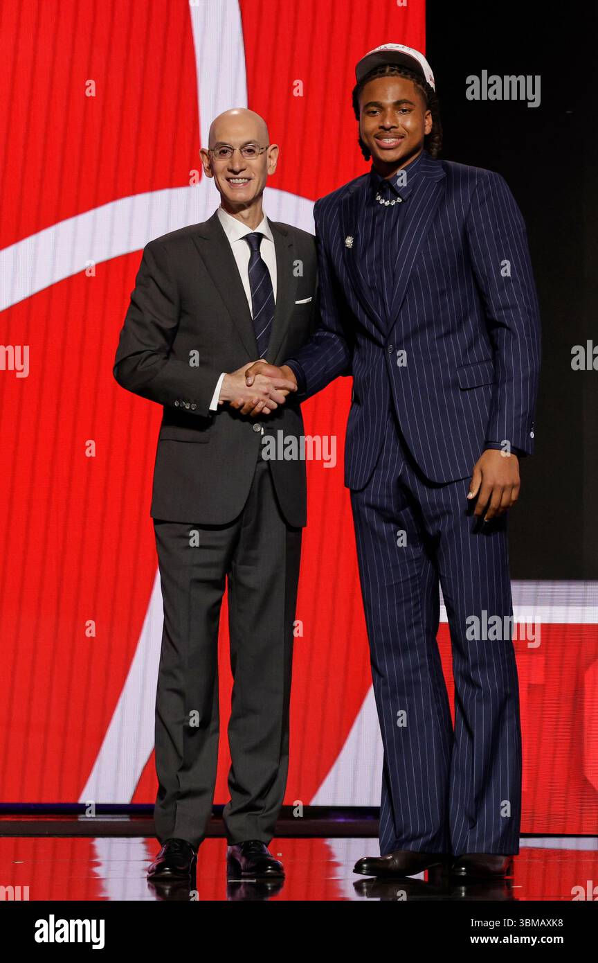 Collin Murray-Boyles poses for a photo with NBA commissioner Adam ...