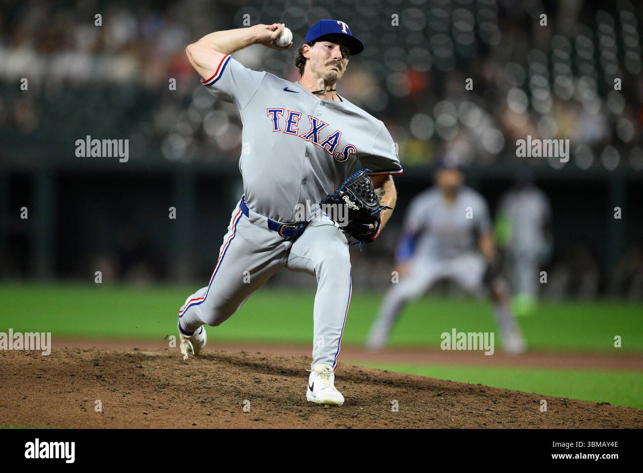 Texas Rangers relief pitcher Cole Winn throws during the ninth inning ...