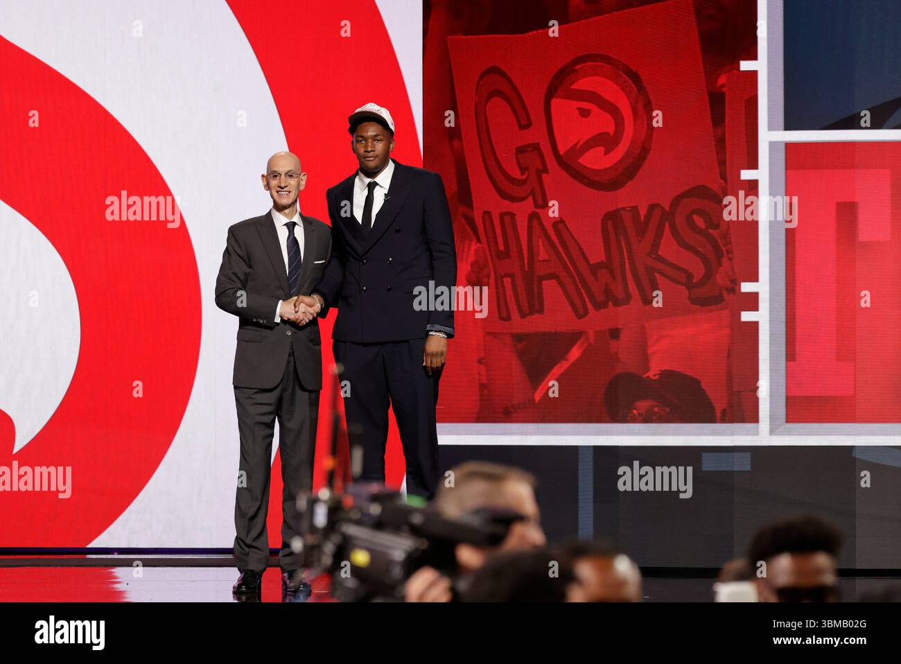 Derik Queen poses for a photo with NBA commissioner Adam Silver after ...