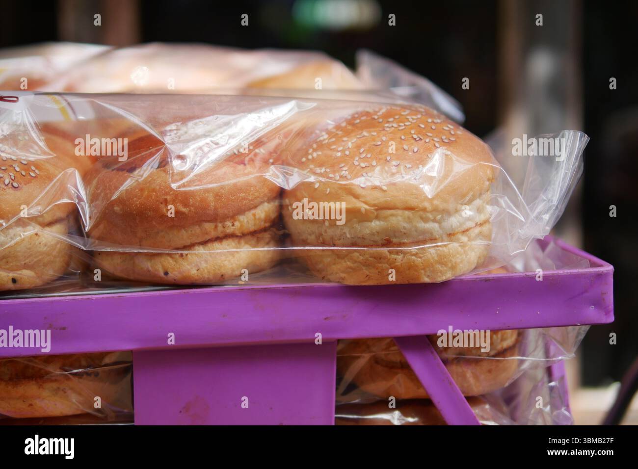 Freshly packaged bread rolls at a market stall Stock Photo - Alamy