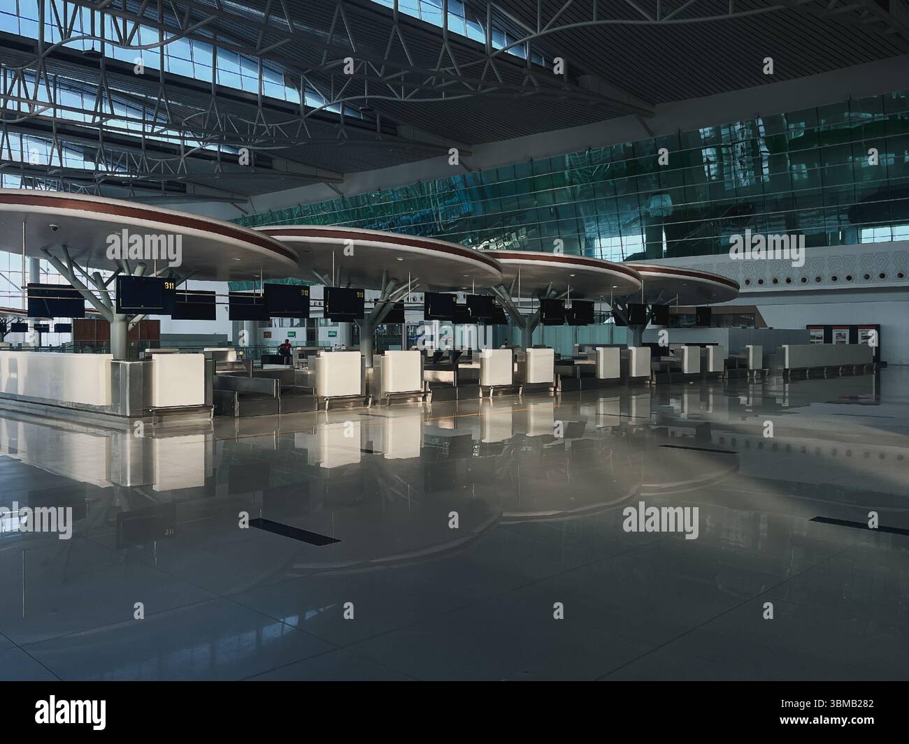 Balikpapan, Indonesia – June 25th 2025. he clean and expansive check-in area of a contemporary ...