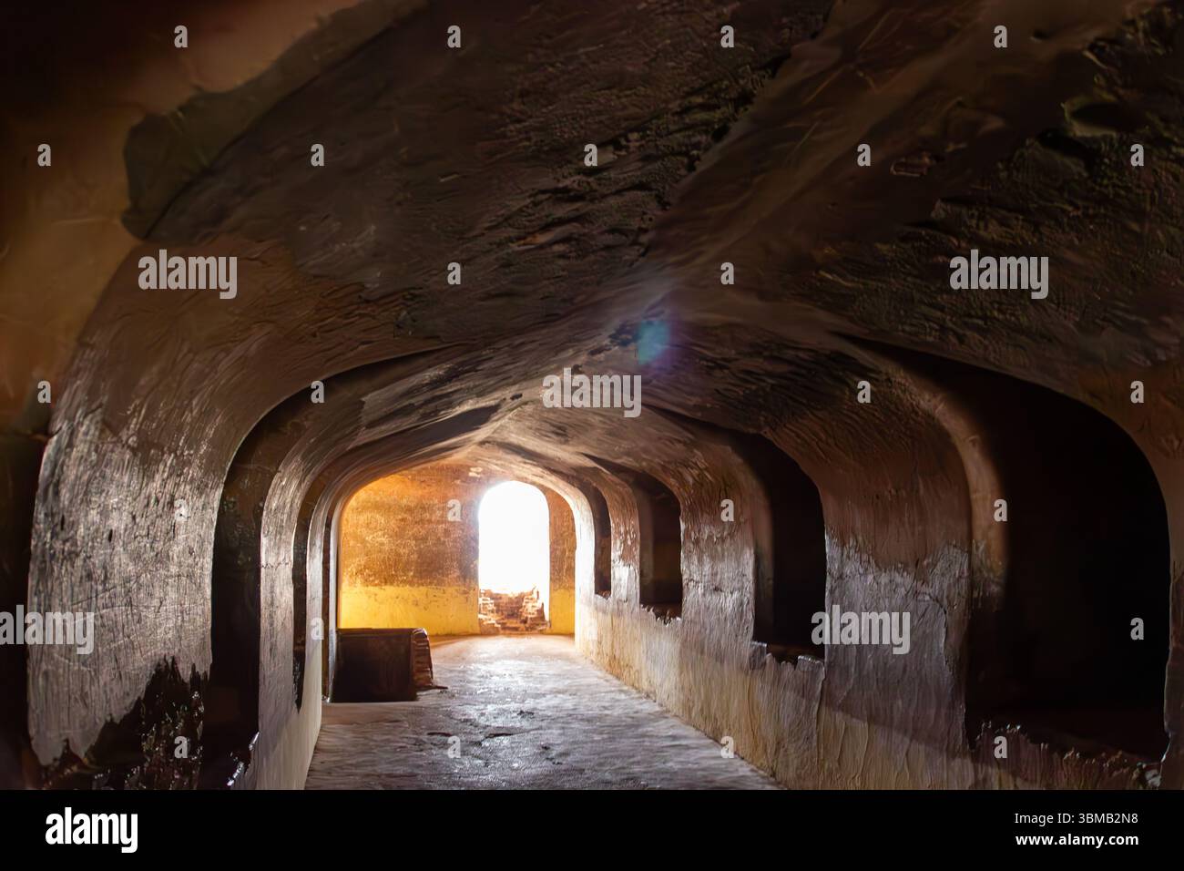 Vaulted Passageway with Distant Light Stock Photo - Alamy