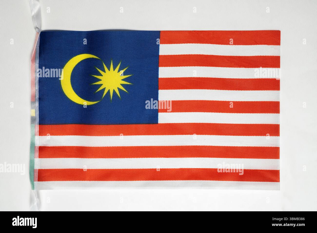 Closeup view of the Malaysia national flag isolated over a white ...