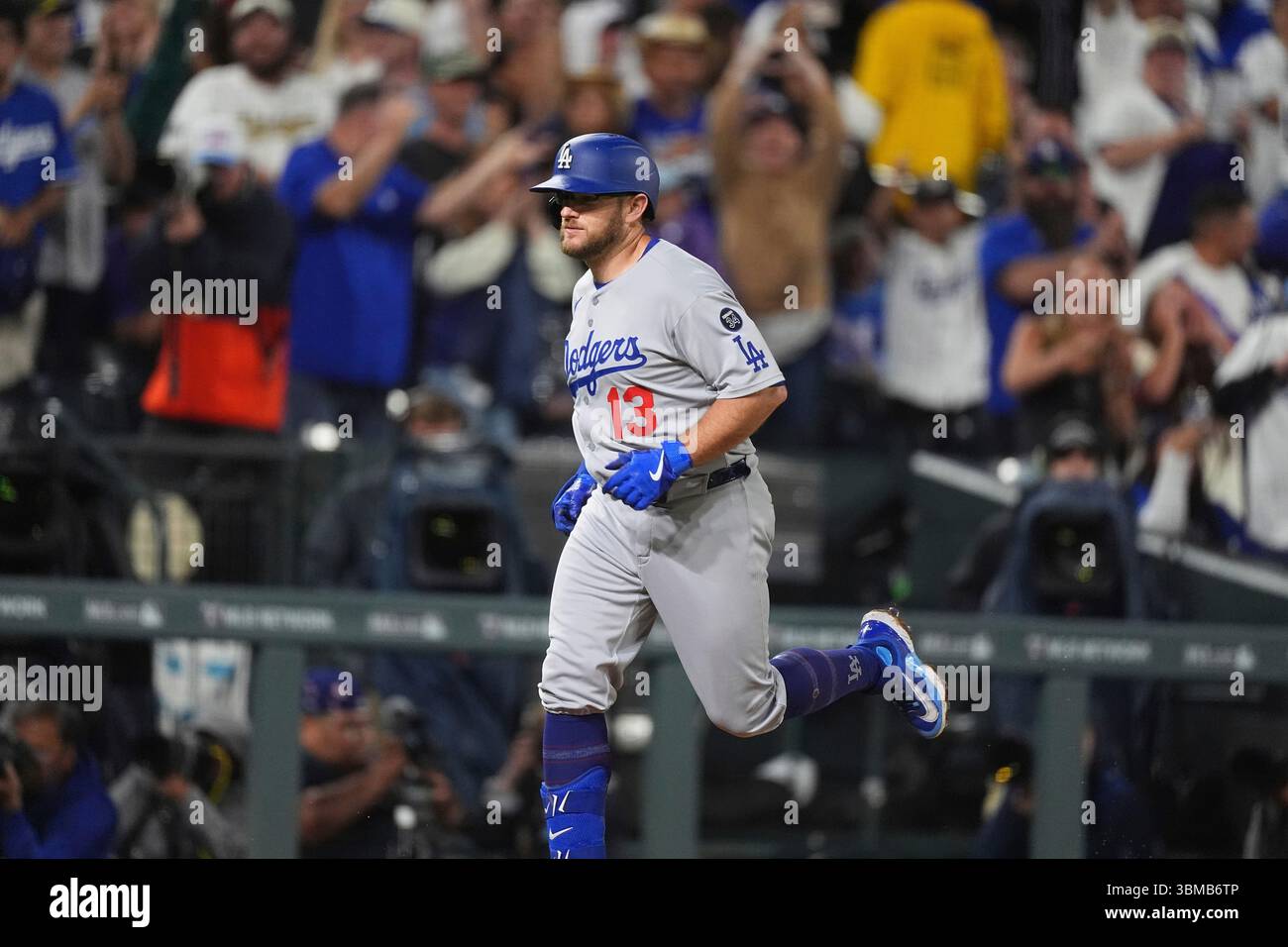 Los Angeles Dodgers' Max Muncy circles the bases after hitting a grand ...
