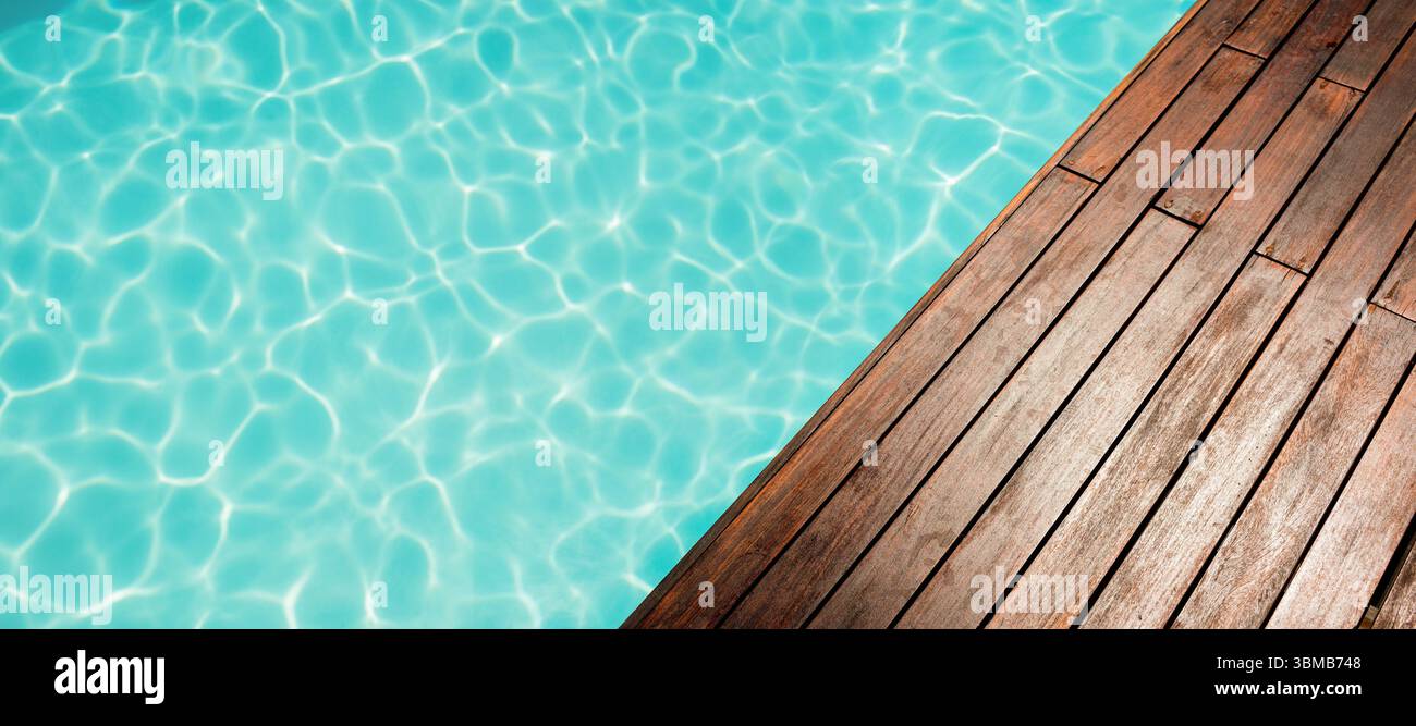 Brown pier by swimming pool Stock Photo - Alamy
