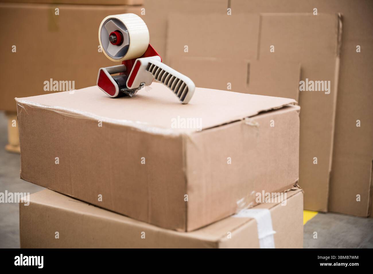 Equipment on cardboard box in warehouse Stock Photo - Alamy