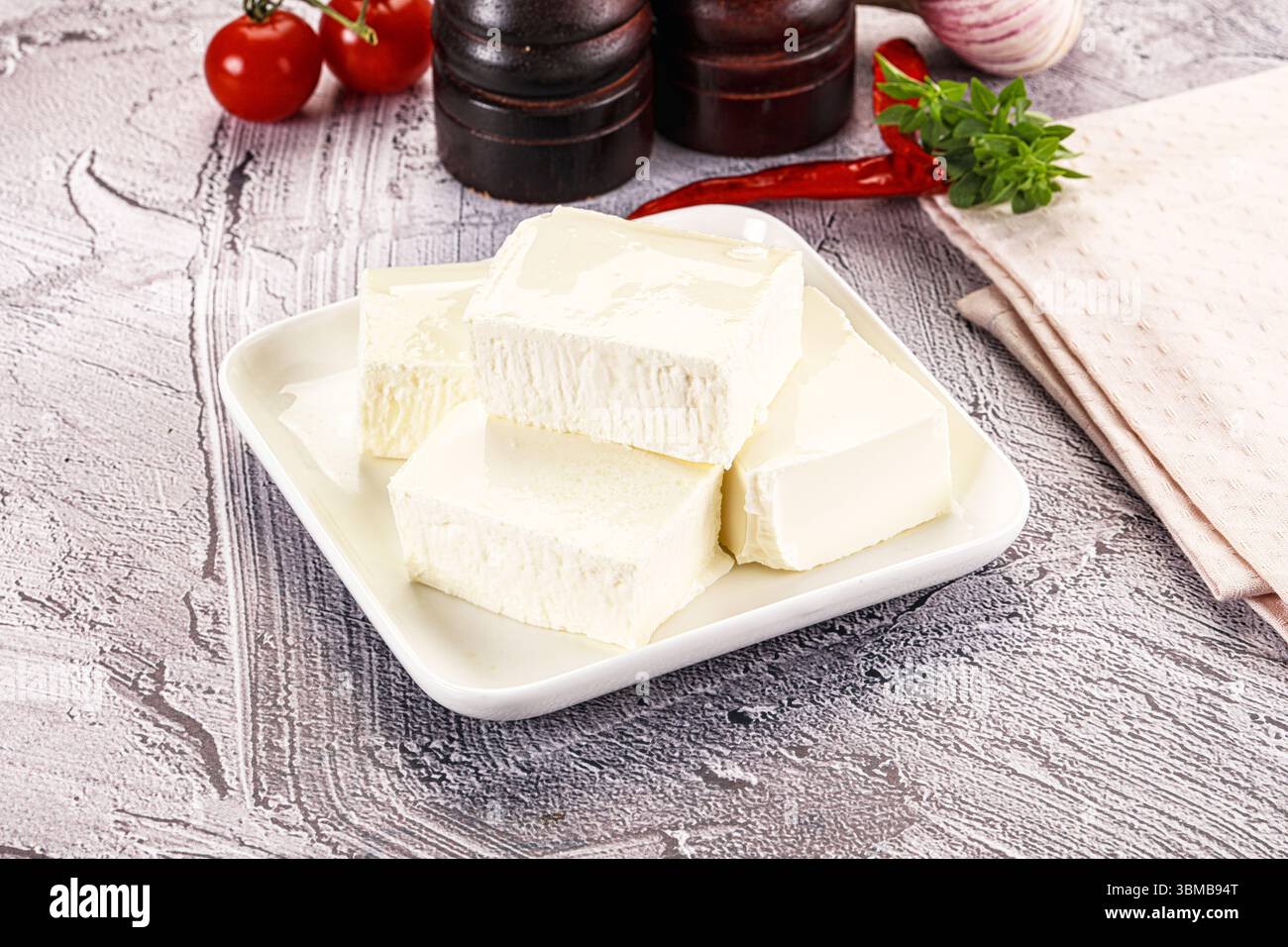 Greek traditional cuisine - Feta cheese bricks Stock Photo - Alamy