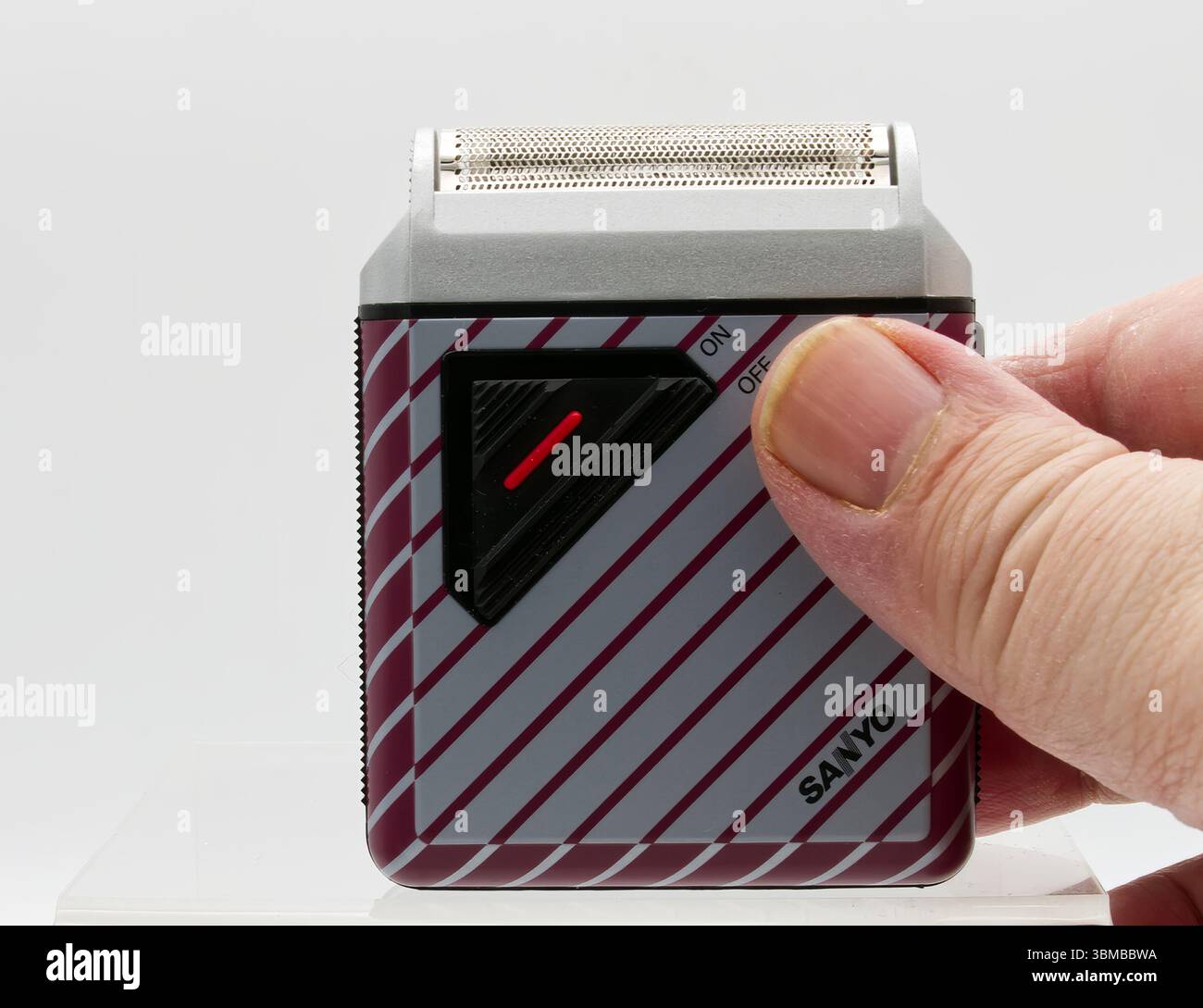Vintage sanyo electric shaver on white background for grooming and ...