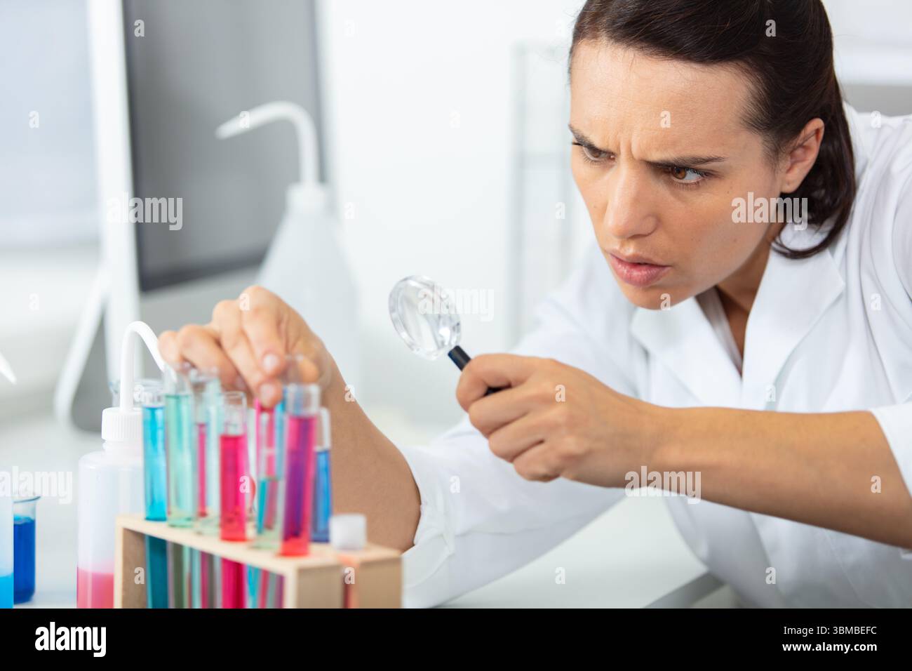 Focused lab technician in blue hi-res stock photography and images - Alamy