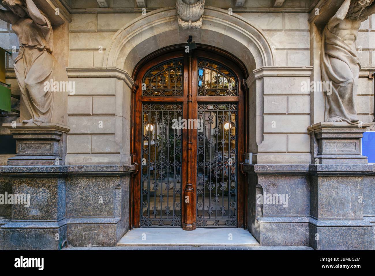 A beautifully crafted wooden entrance door with intricate details and a ...