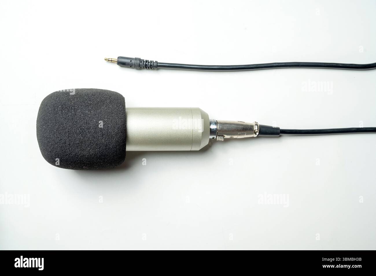 Studio microphone for podcasting or streaming with connected cable on a ...