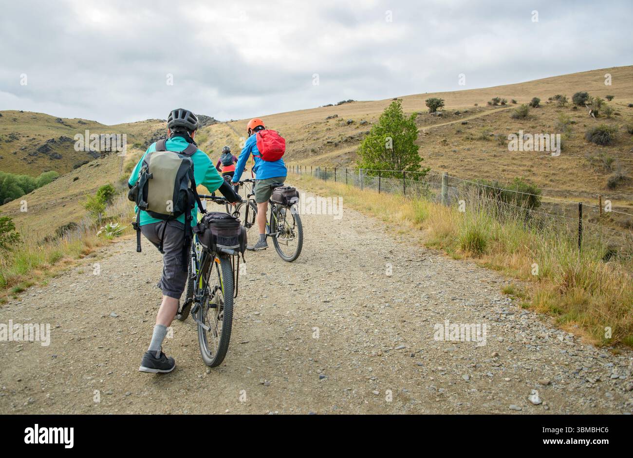 People getting on bikes and cycling Otago Central Rail Trail. South ...