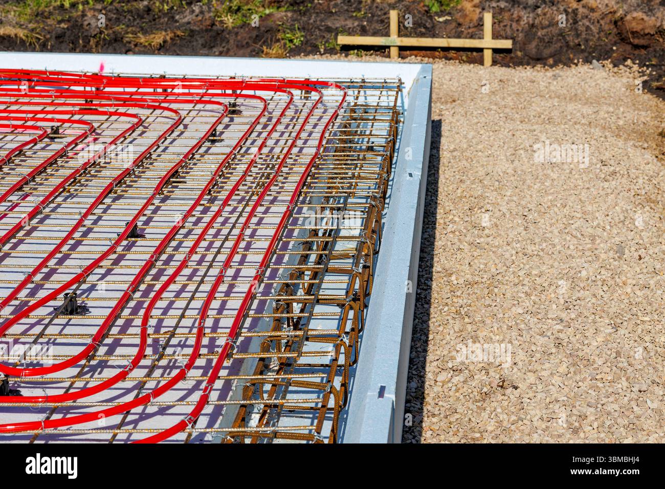Underfloor heating system with red pipes on construction site Stock ...