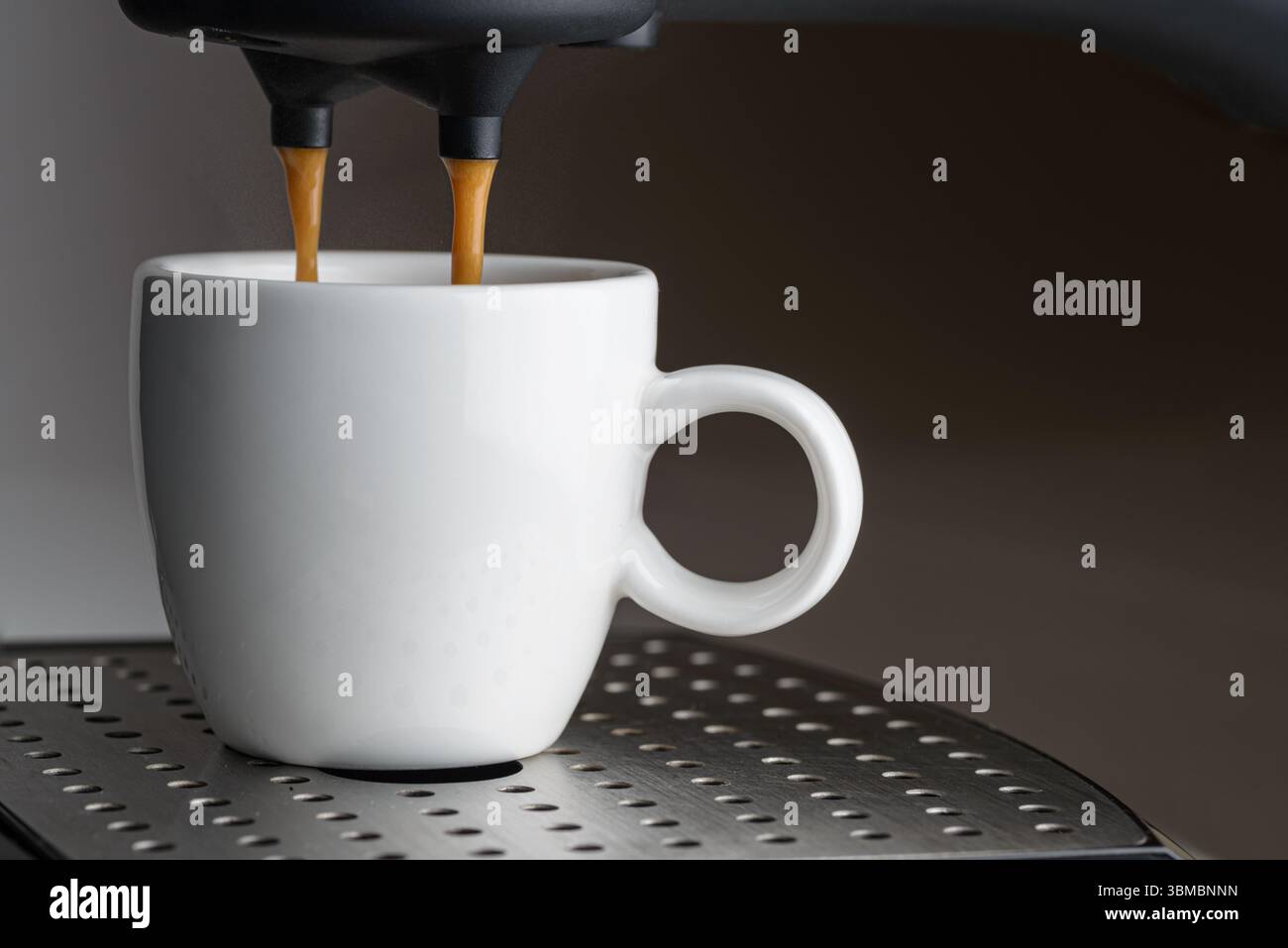 Coffee machine pouring a cup of espresso Stock Photo - Alamy