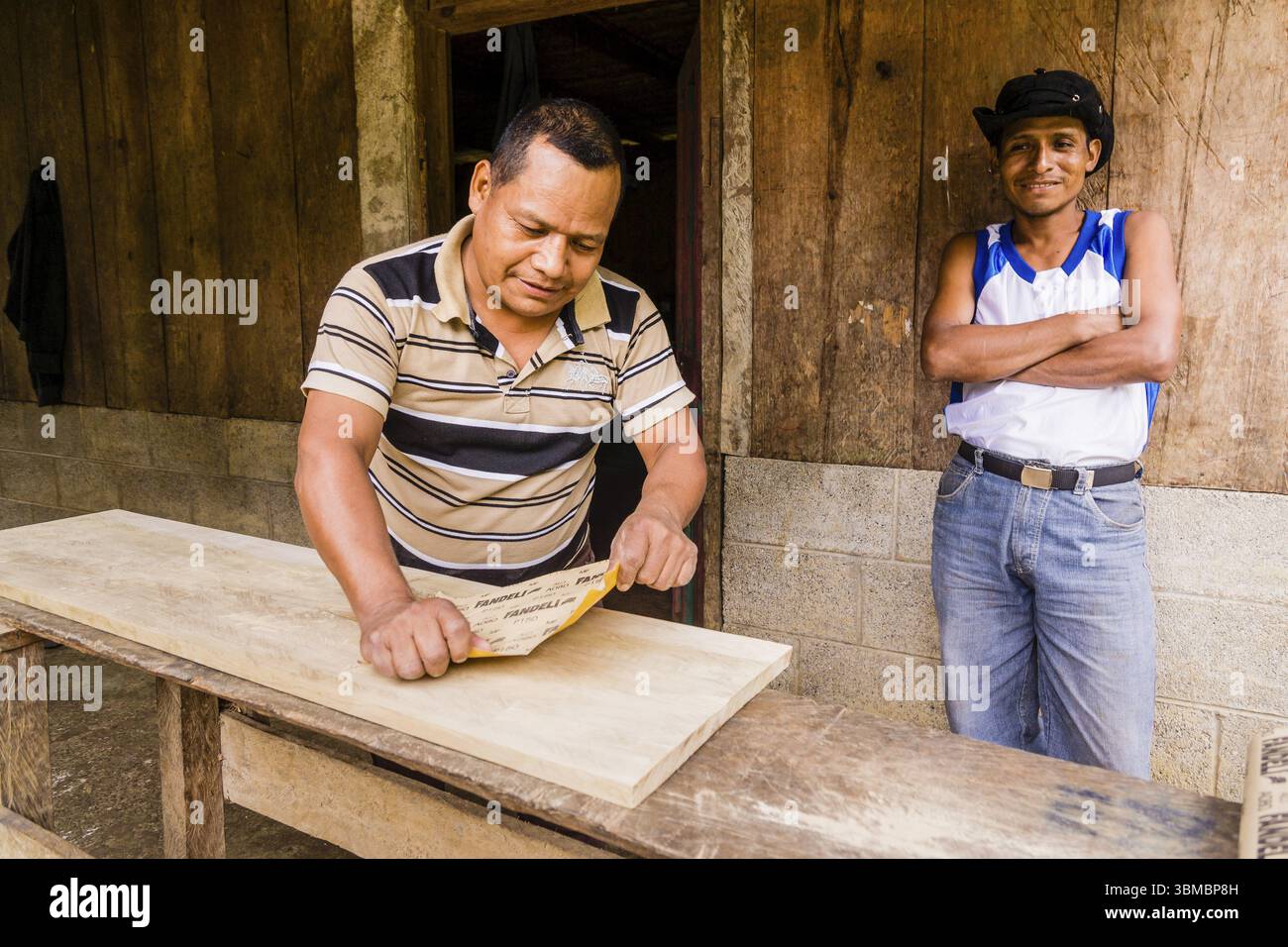 Carpenter repairing a hut, village of Panama, near La Parroquia ...