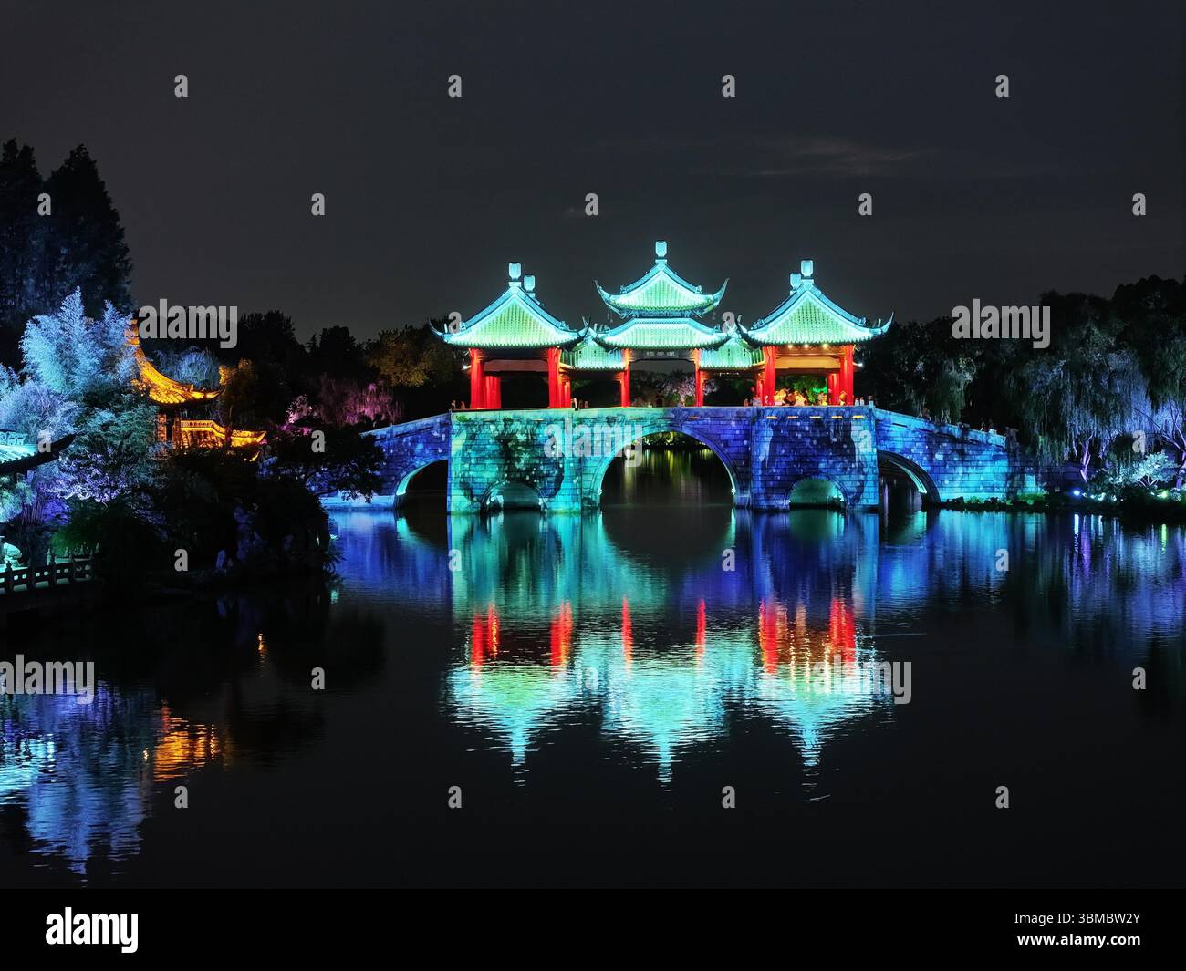 Aerial photo shows the night view of Slender West Lake scenic area in ...