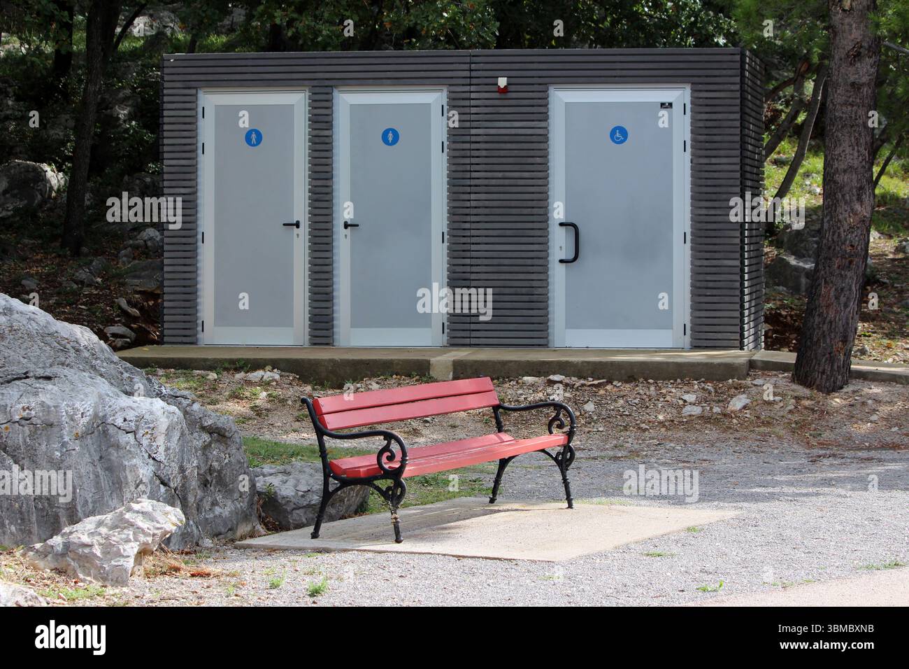 Modern public restroom facility with three doors, including accessible ...