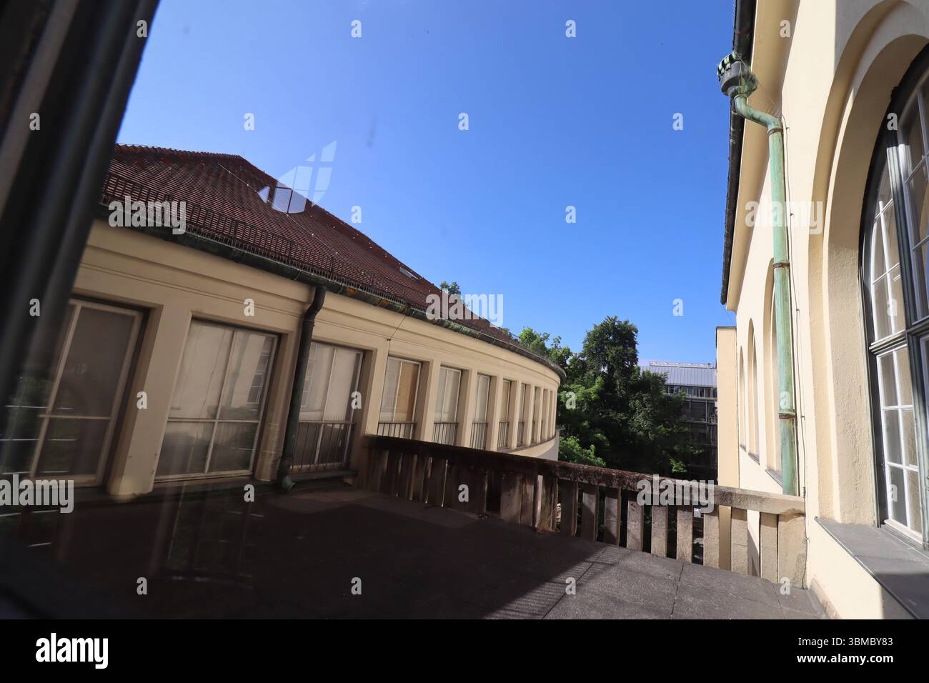 MUNICH, GERMANY - JUNE 24, 2025: Sunny courtyard with classical ...