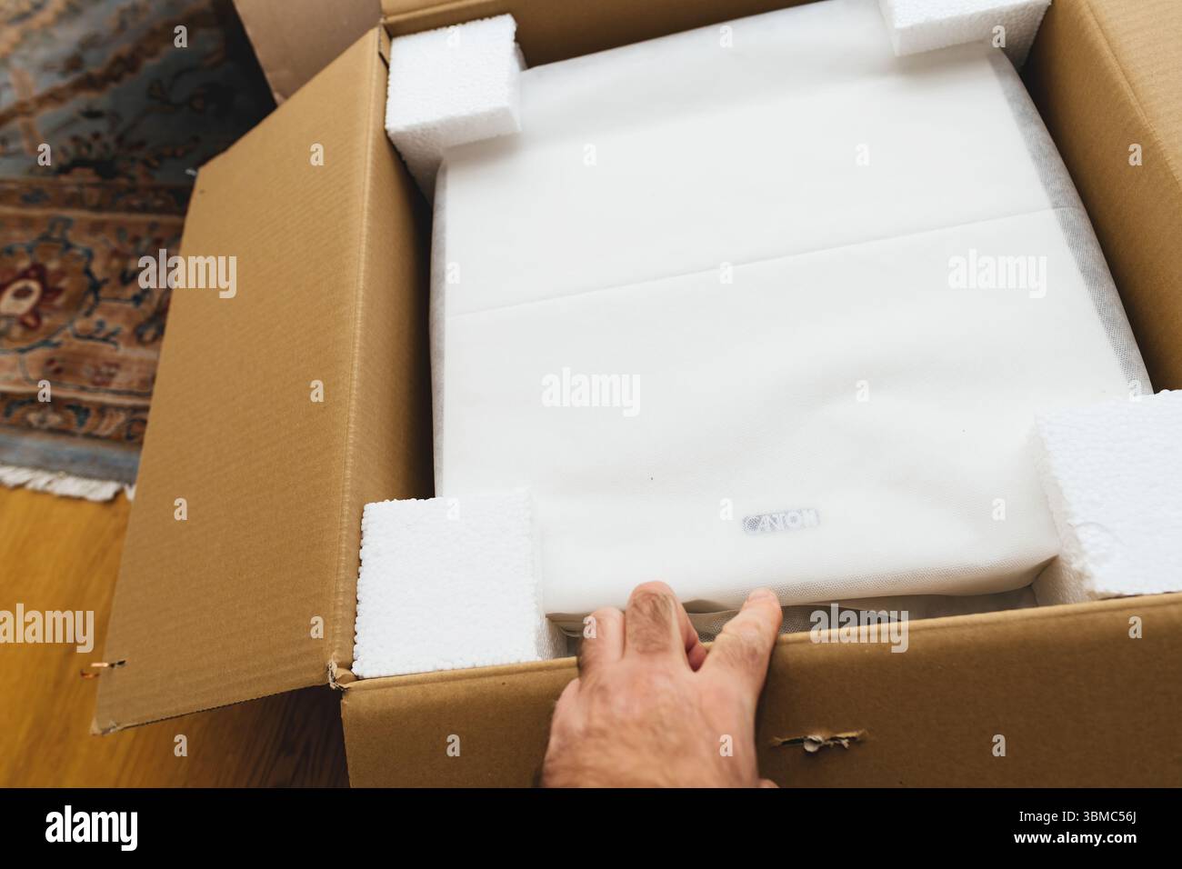 Paris, France - Nov 29, 2024: Canton subwoofer partially unboxed from ...
