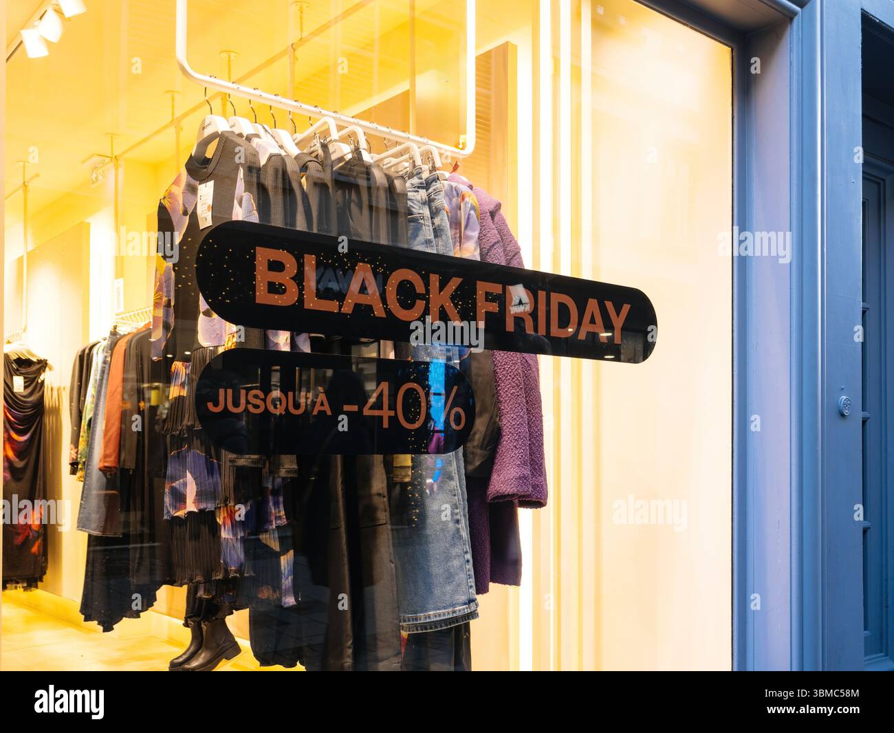 A Black Friday sale sign reading up to -40 percent is applied on a shop ...