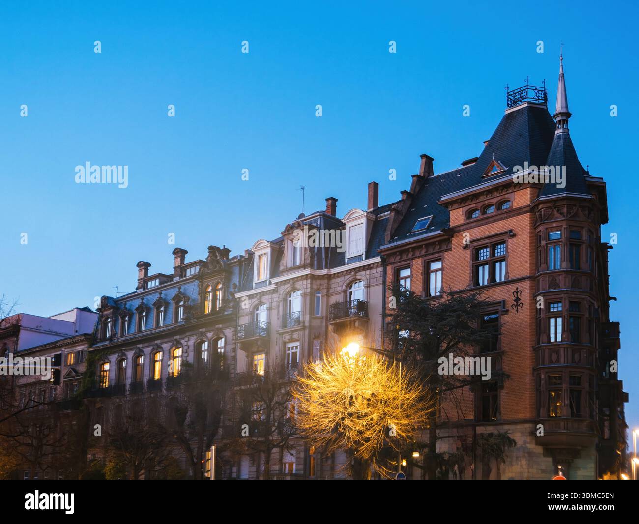 Elegant historic buildings with ornate facades and a prominent turret ...