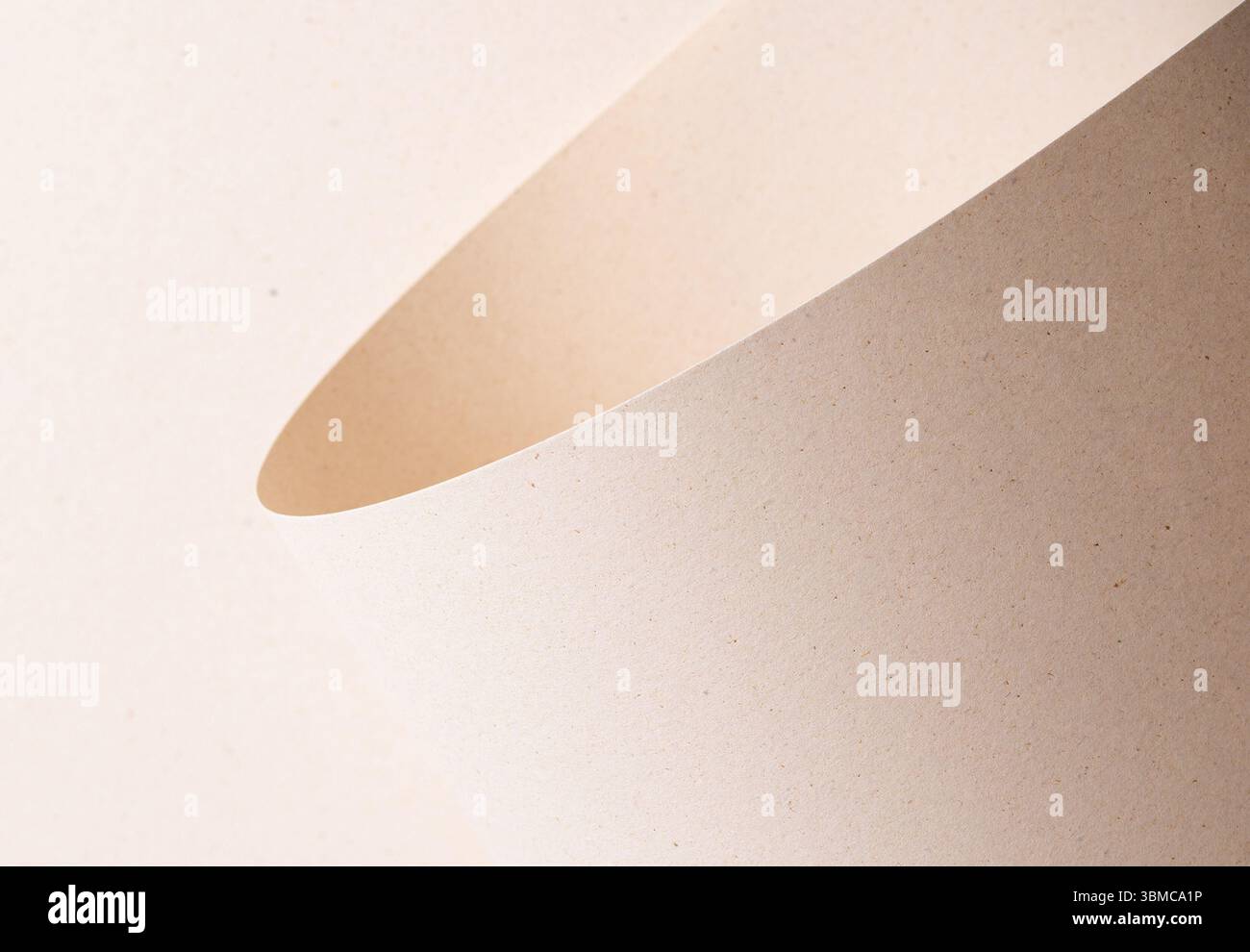 Curved sheet of elegant designer paper in creamy beige tones with ...