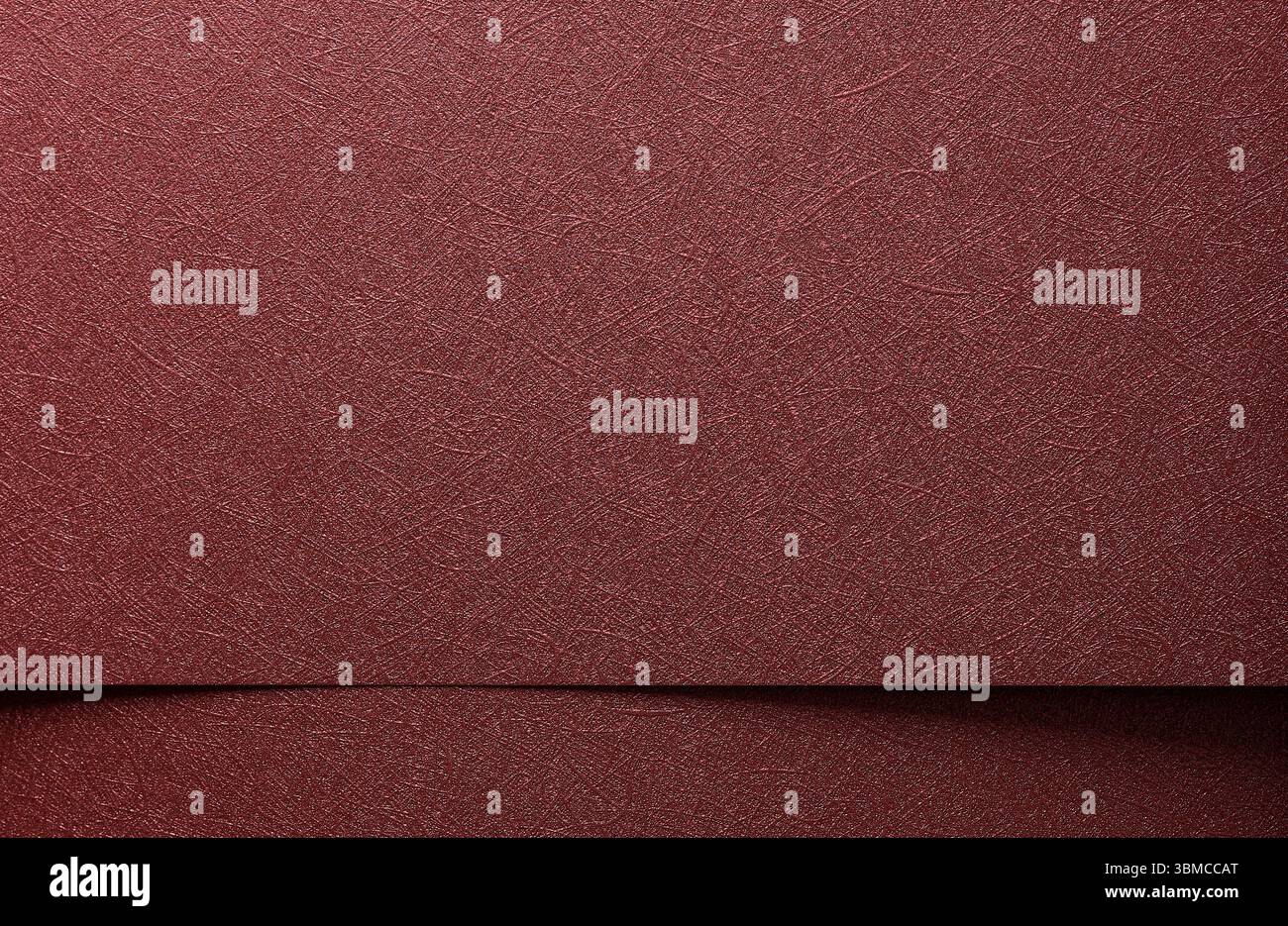 Metallic paper background closeup. Monochrome red and marsala sheets ...
