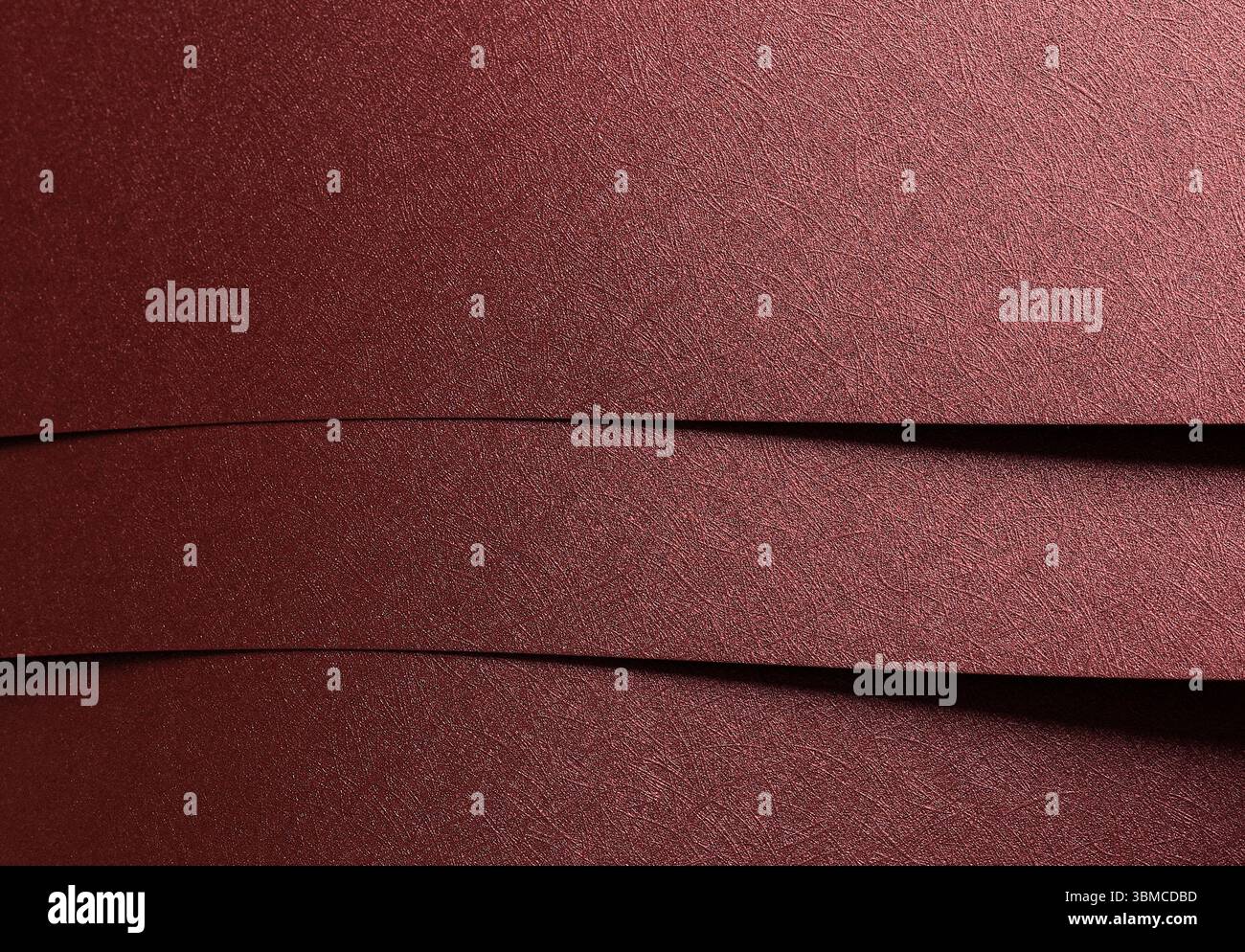 Paper background closeup. Red and marsala metallic sheets with ...