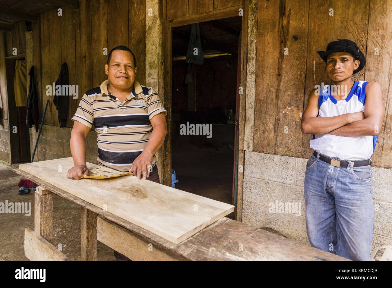 Carpenter repairing a hut, village of Panama, near La Parroquia ...