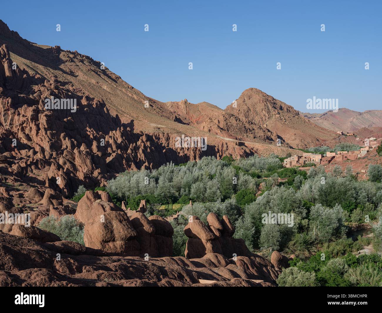 Morocco, 25 May 2025. A modern hotel complex blends into the rocky red ...