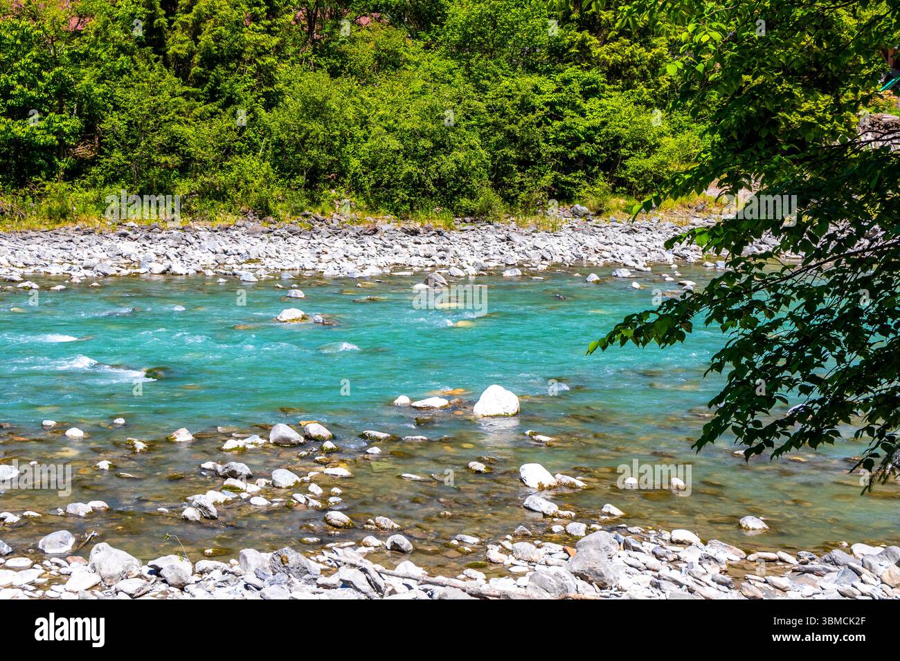 Turquoise blue and green river steam and waterfall Inn with stones ...