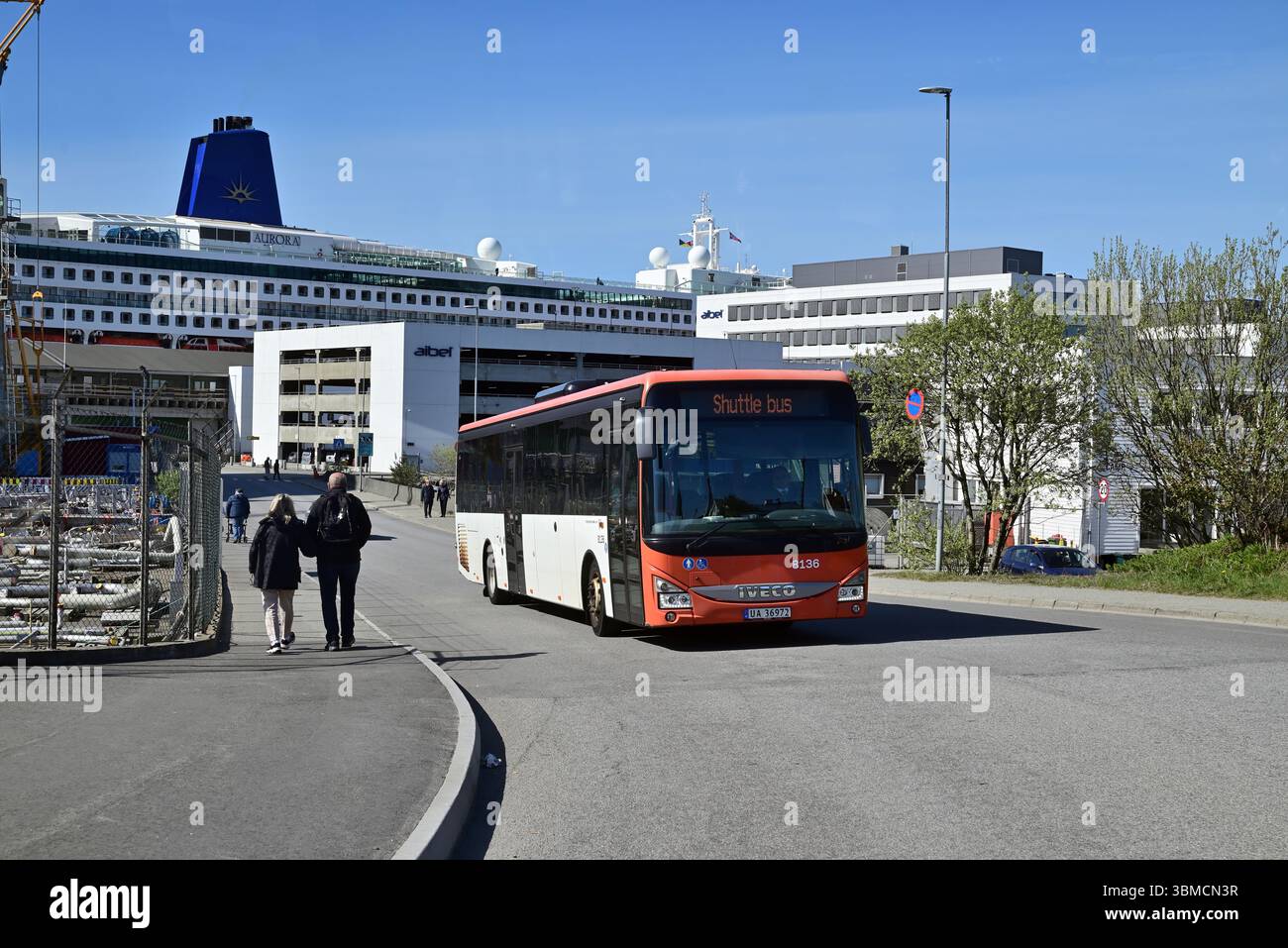 A shuttle bus conveying passengers from a visiting cruise ship through ...