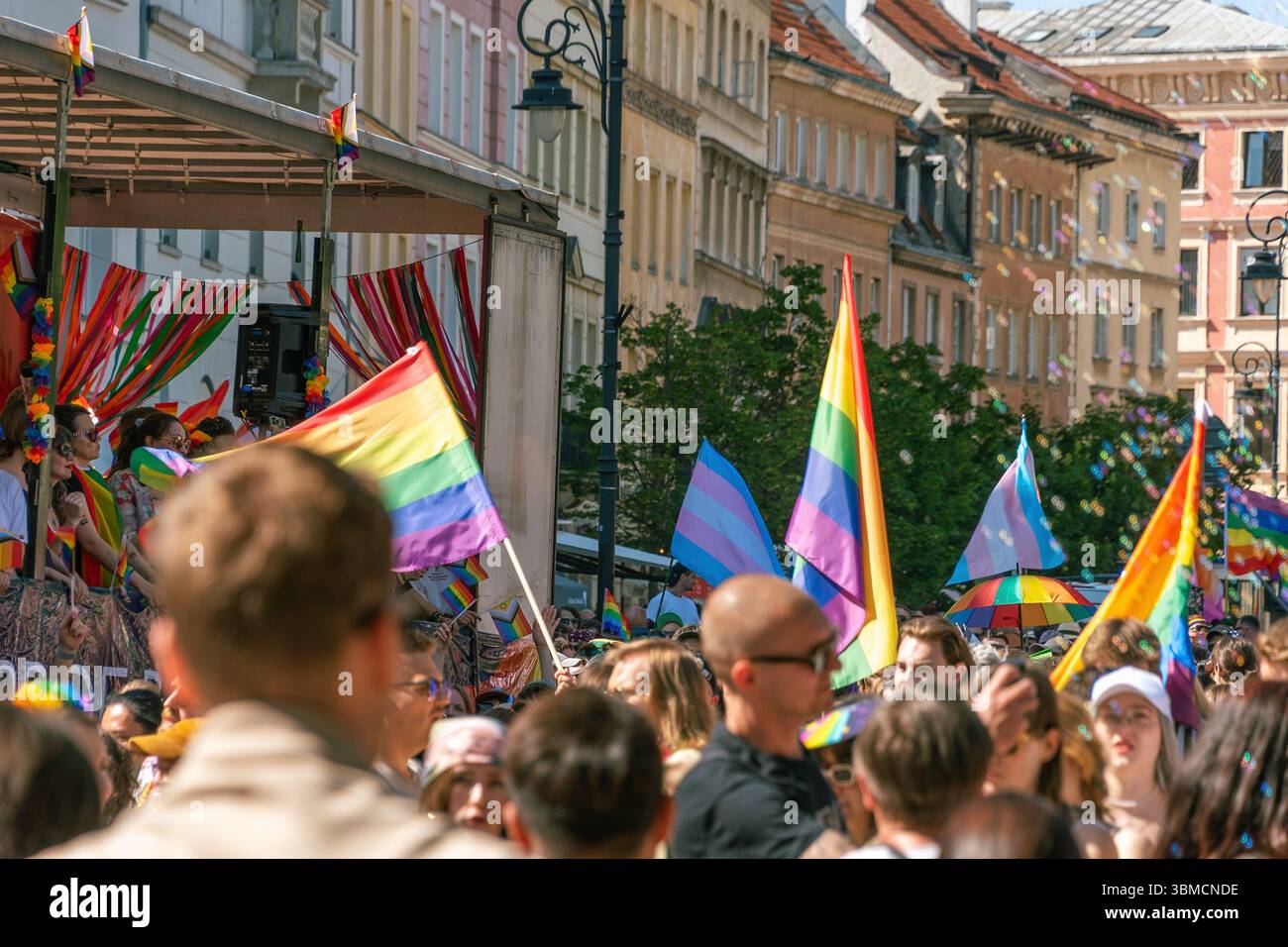 Colorful lgbtq+ pride parade with diverse crowd and rainbow flags in ...