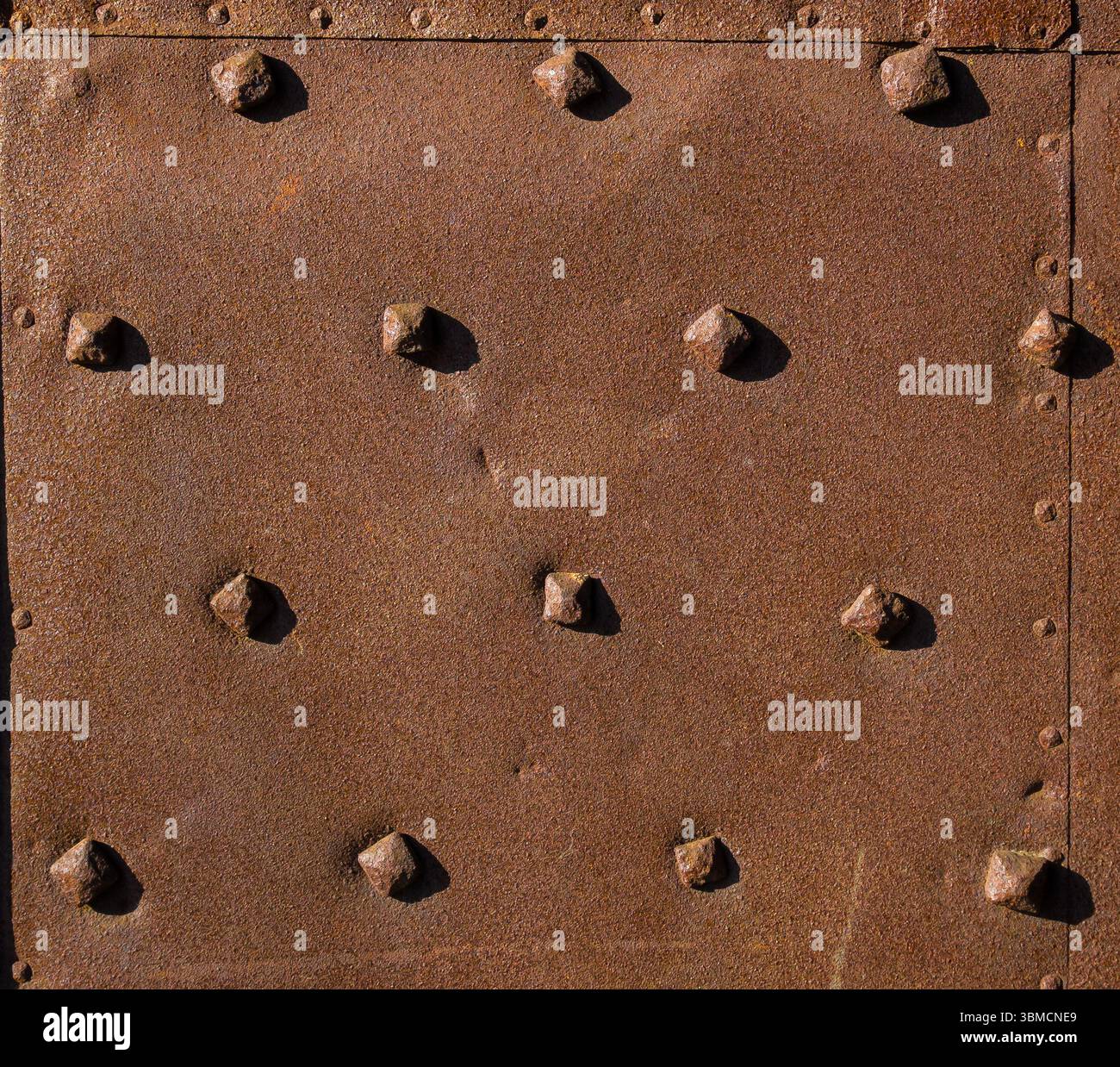 Old and rusty iron panel with bolts as background Stock Photo - Alamy