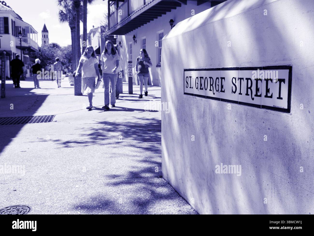 Tourists exploring St. George Street, a popular pedestrian shopping and ...