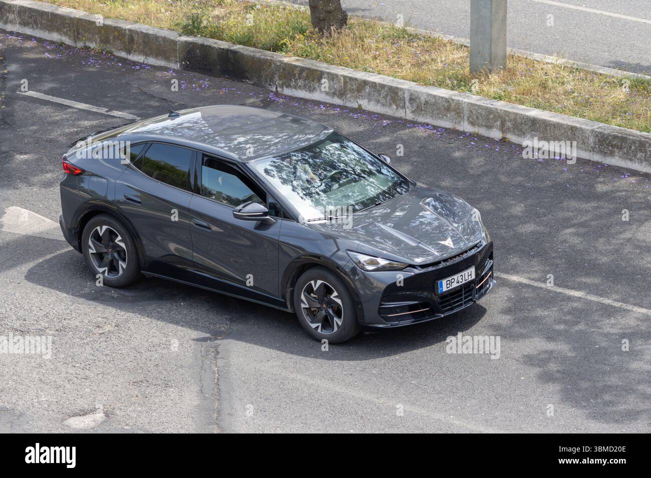 Modern gray electric car driving on the road, aerial view Stock Photo ...