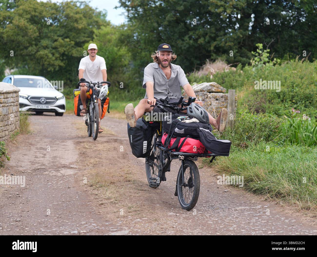 British singer-songwriter Jack Cullen arrives on a bike at the Glastonbury Festival at Worthy ...
