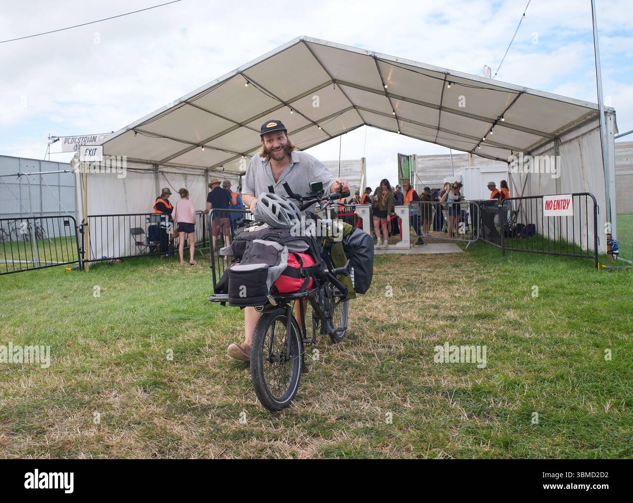 British singer-songwriter Jack Cullen arrives on a bike at the ...