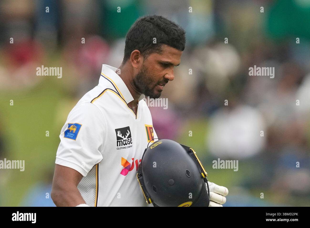 Sri Lanka's Dinesh Chandimal leaves the ground after losing his wicket ...