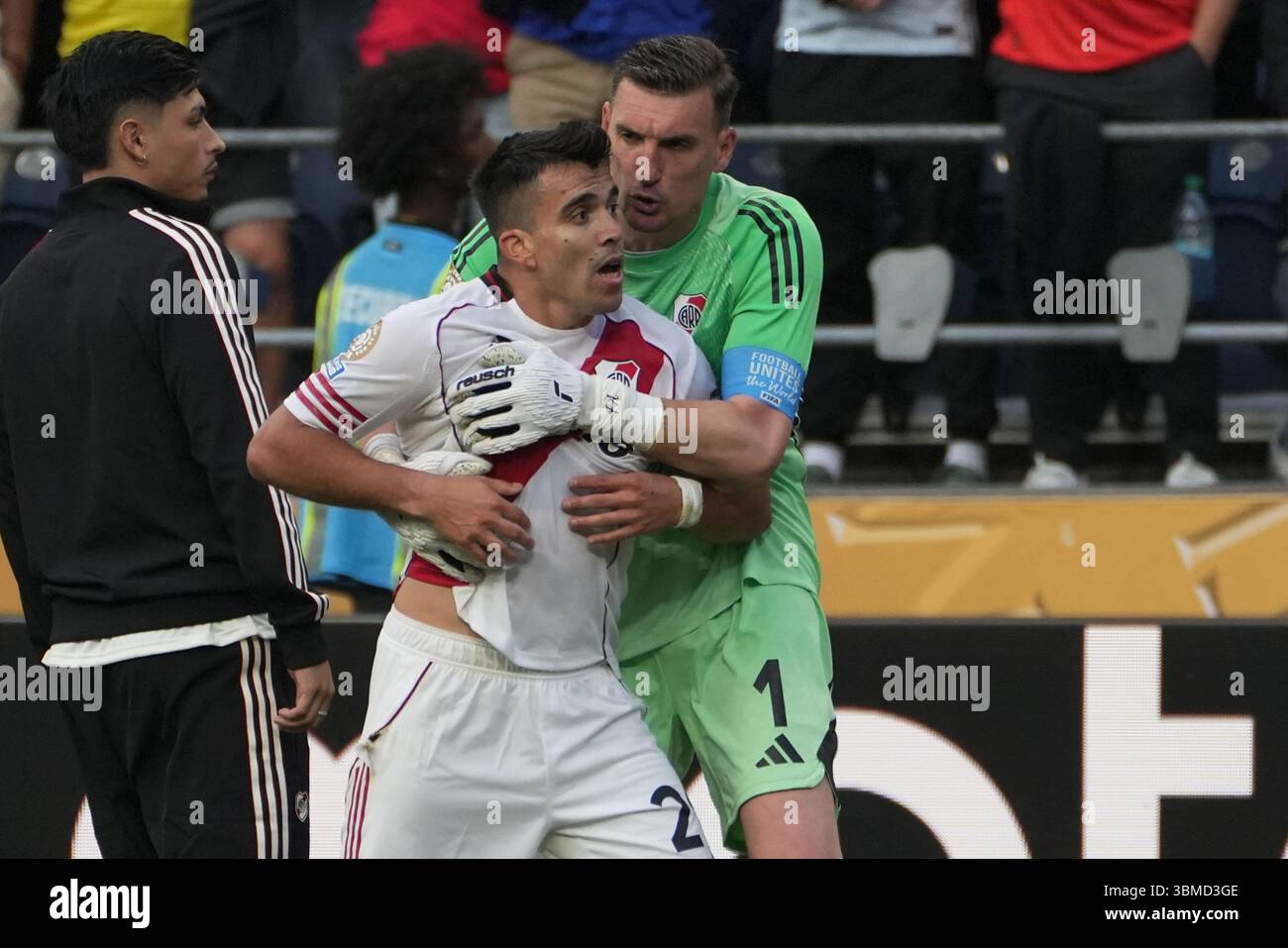 River Plate defender Marcos Acuña (21) is held back from an altercation ...