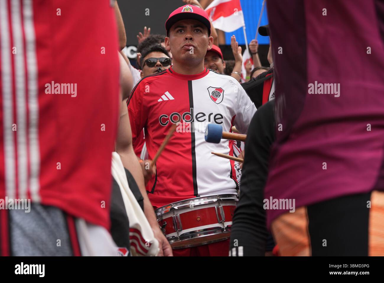 A River Plate supporter leads the crowd in song before a FIFA Club ...
